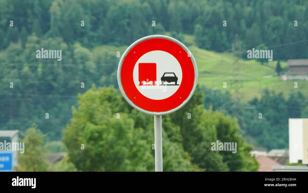No overtaking for trucks road sign on highway Stock Photo - Alamy