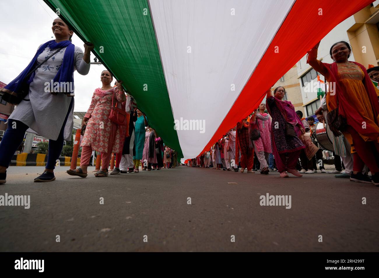 People march carrying a giant Indian flag ahead of Independence Day in ...