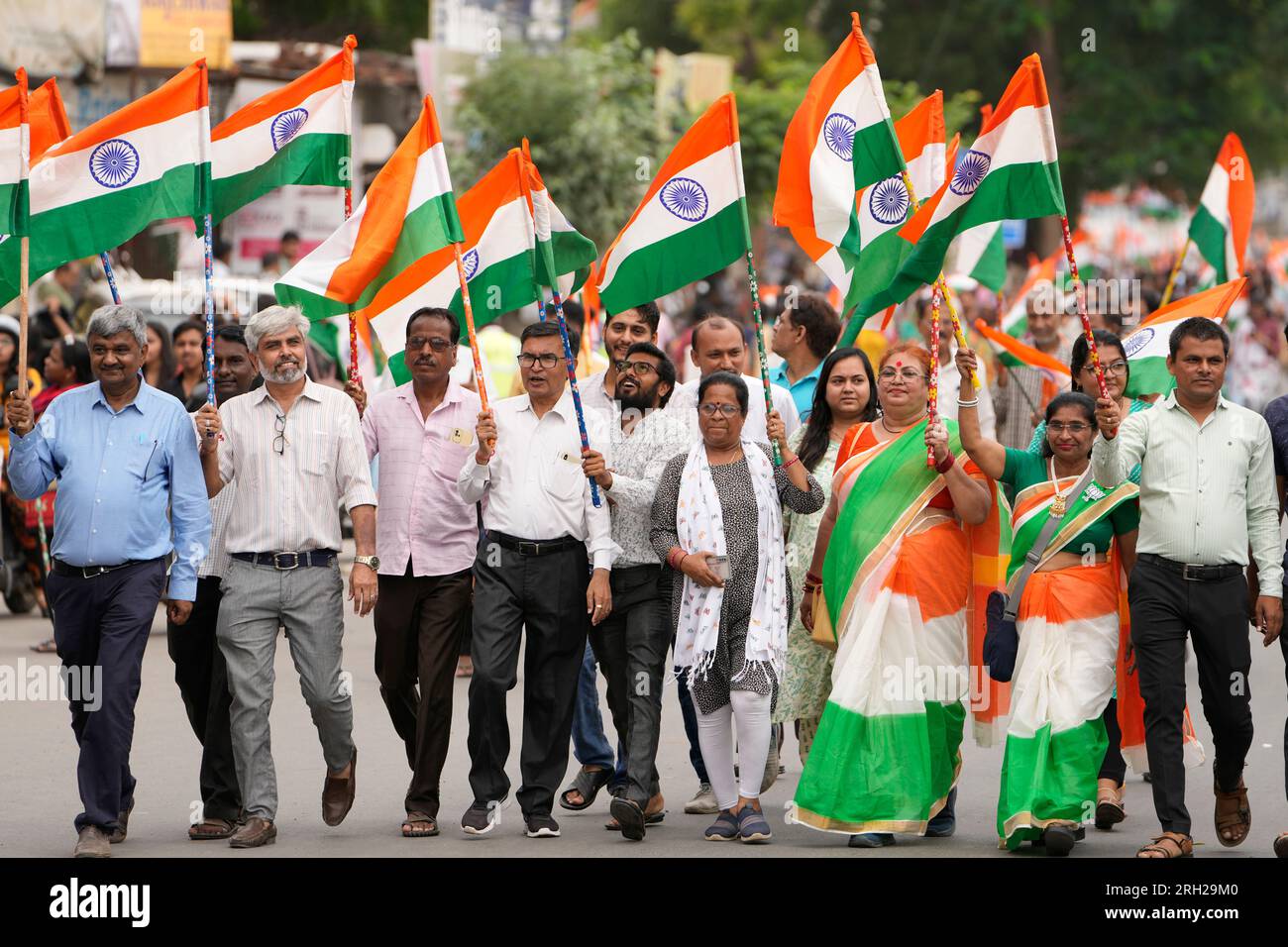 People march carrying Indian flags ahead of Independence Day in ...