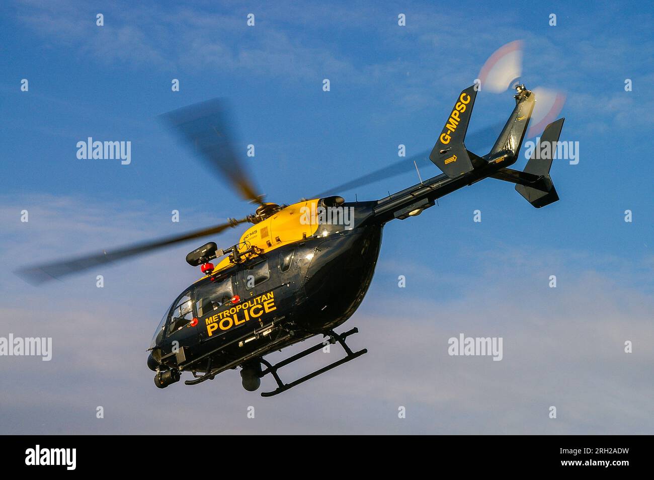 Metropolitan Police helicopter Eurocopter EC145 G-MPSC flying low. Eye ...