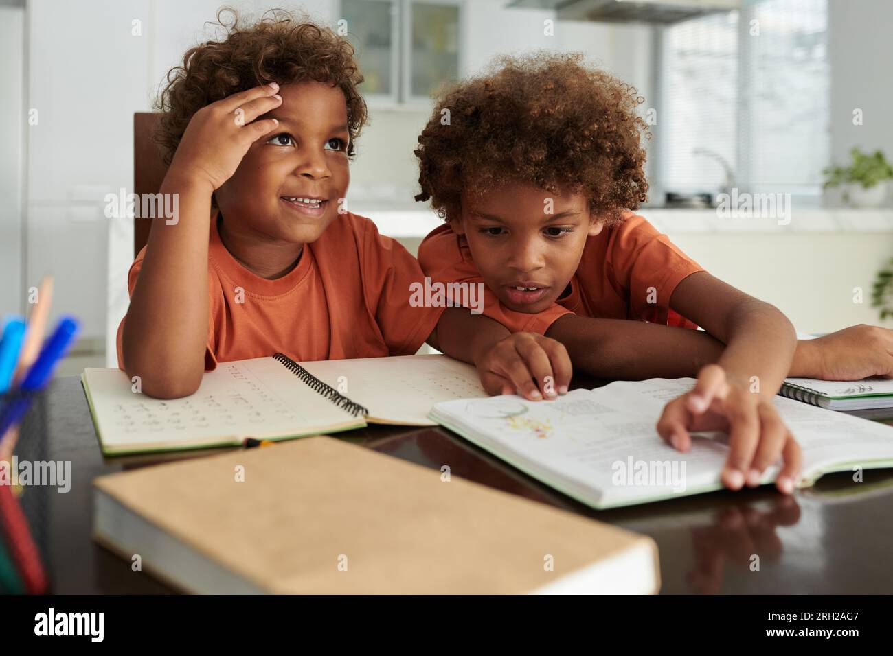 Siblings are being home-schooled, they are learning how to read and ...