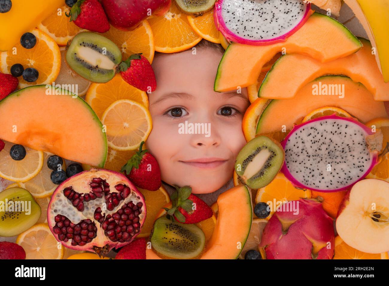 Top view of kids face with different fruits. Summer fruits. Kids face ...