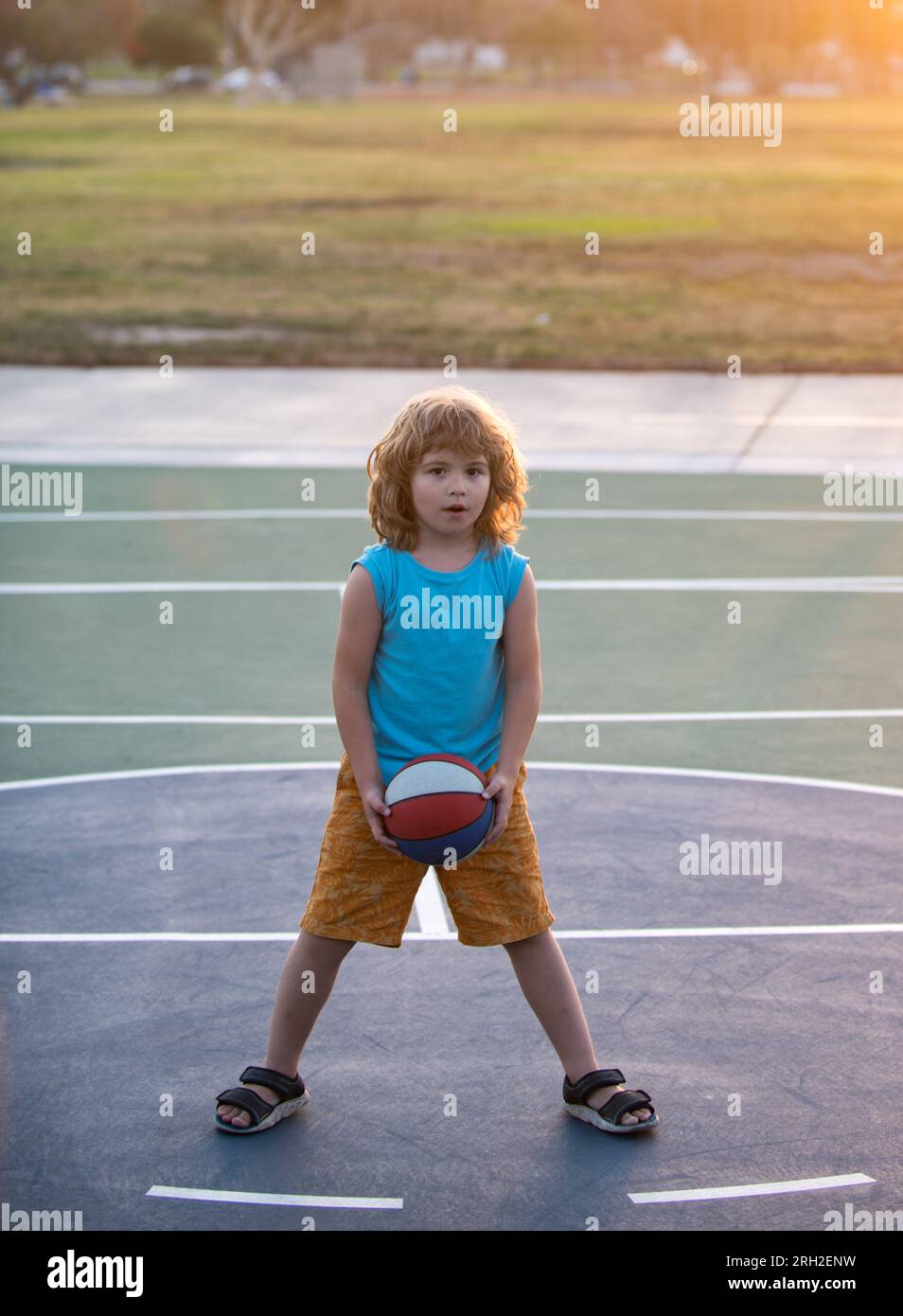 Kid playing basketball. Activity and sport for kids Stock Photo - Alamy