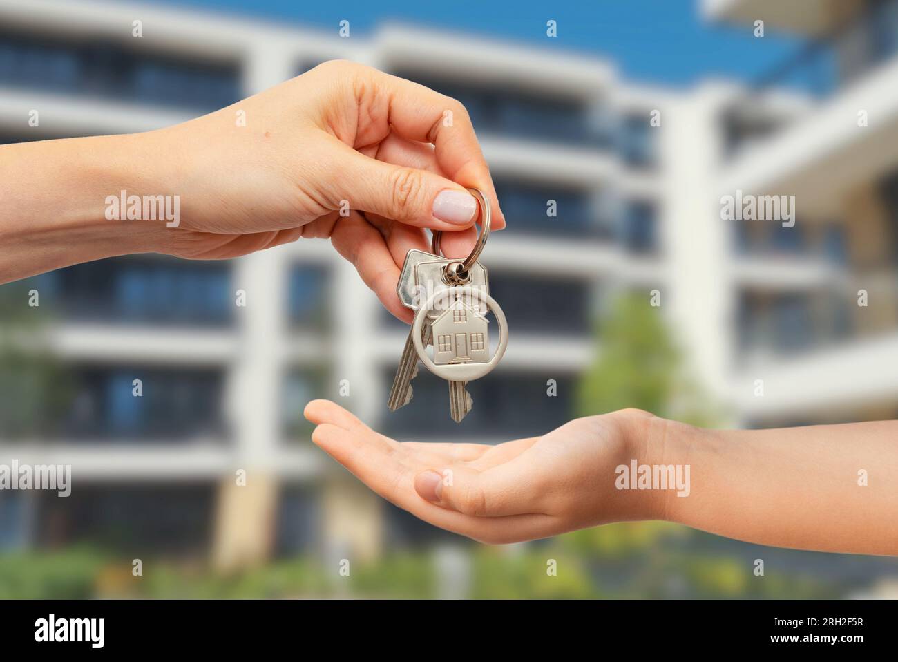 Hand with keys in door hi-res stock photography and images - Alamy