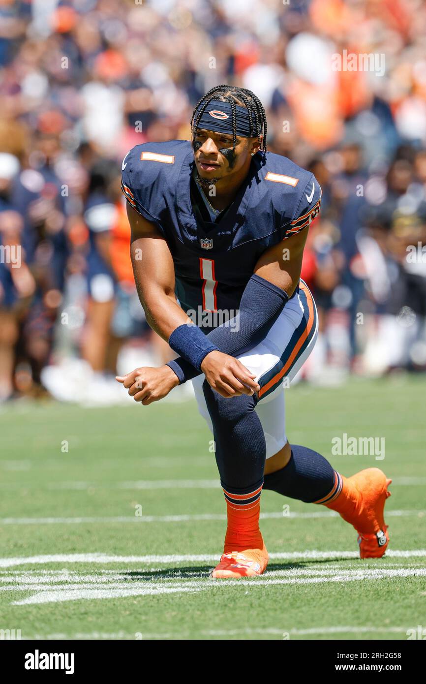 Chicago Bears quarterback Justin Fields kneels on the field prior to an ...