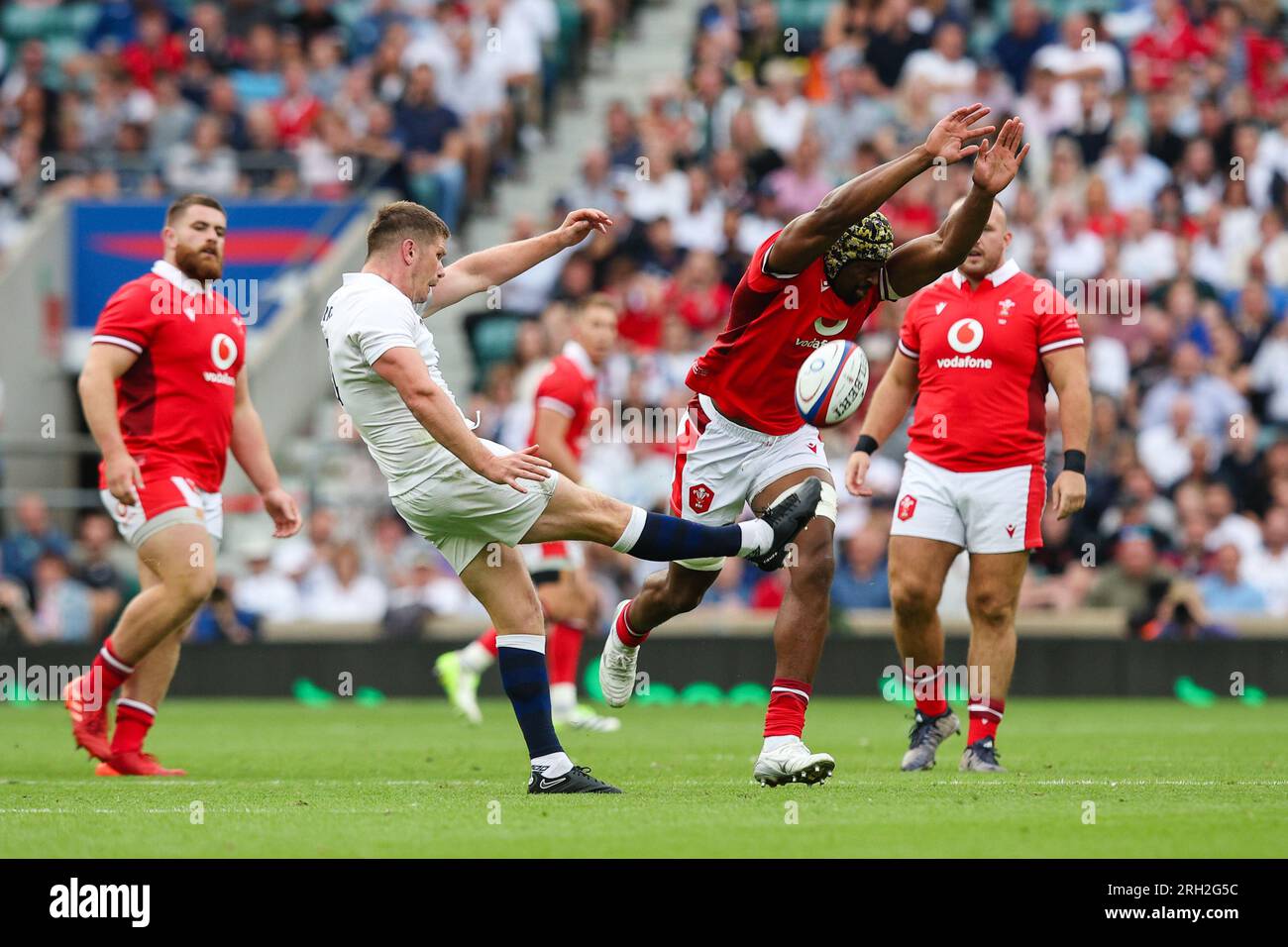 LONDON, UK - 12th Aug 2023: Owen Farrell of England under pressure from Christ Tshiunza of Wales ...