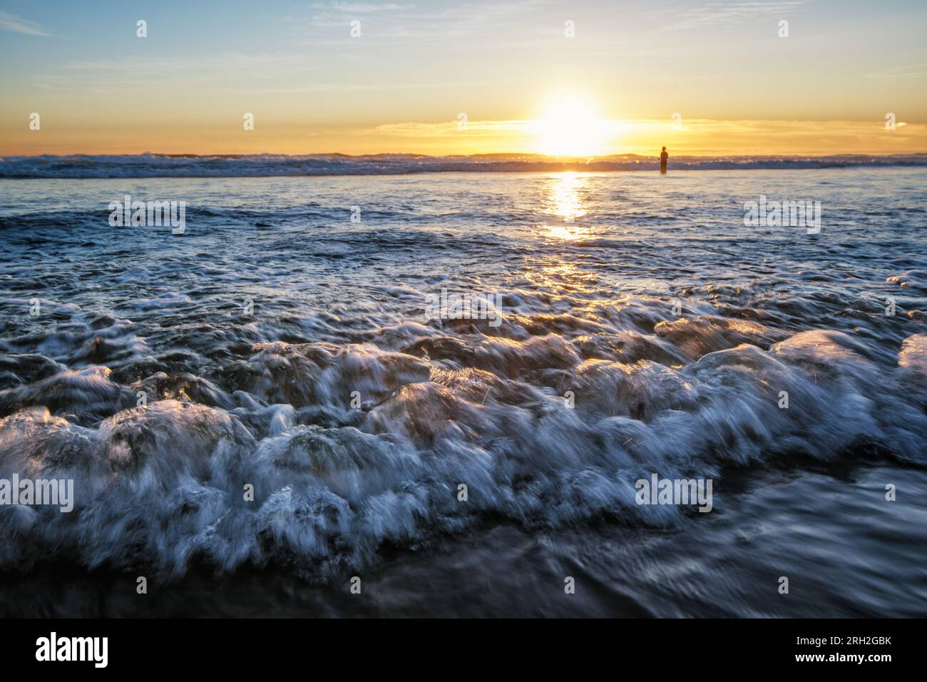 Atlantic ocean sunset with surging waves at Fonte da Telha beach ...