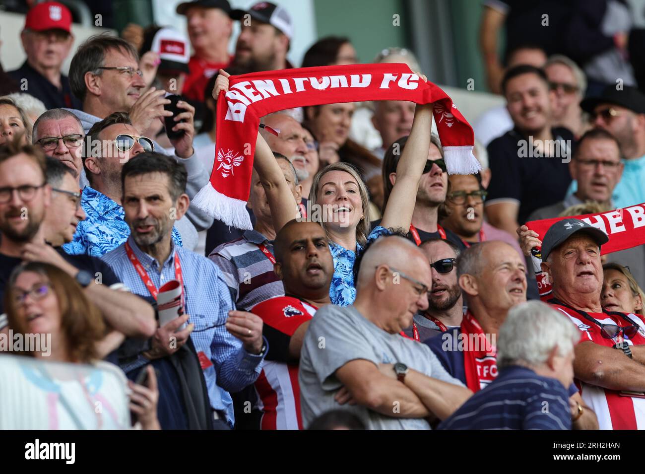 Brentford fans hold up their scarfs during the Premier League match ...