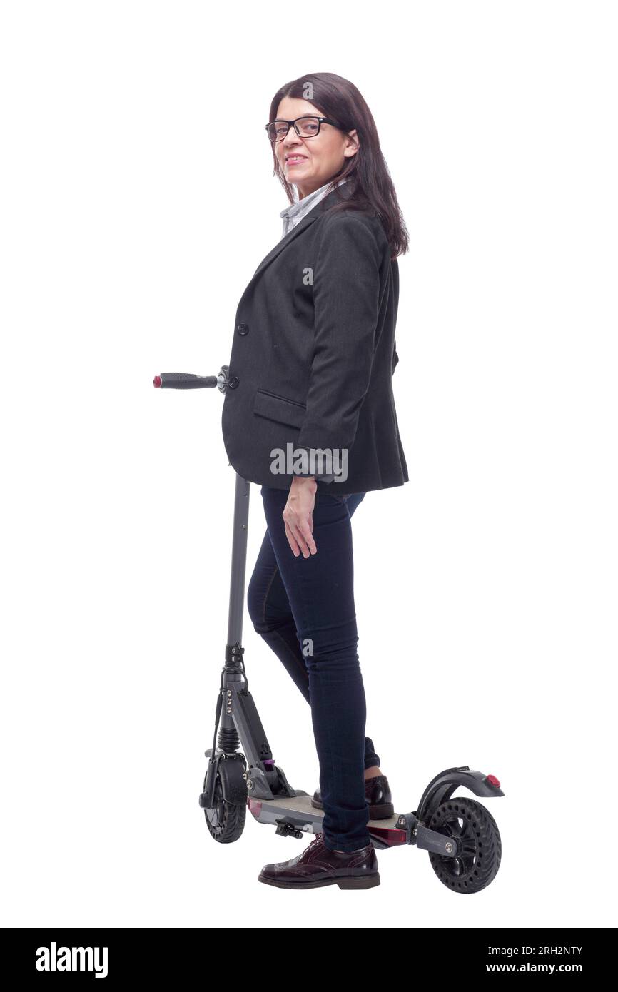 Full length portrait of a woman riding a scooter isolated on white ...