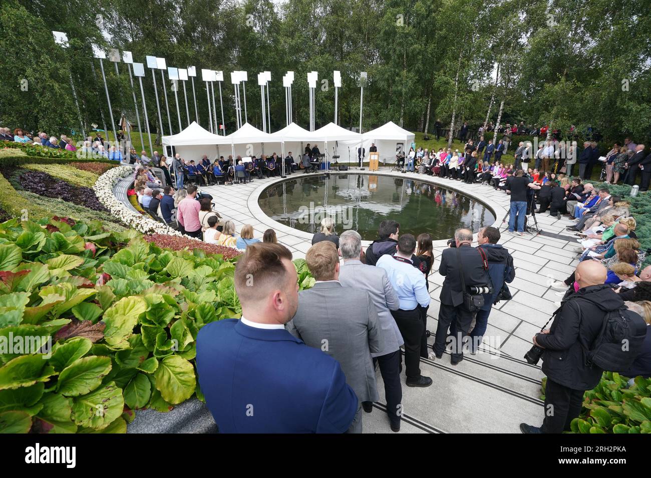 People attend a service to mark the 25th anniversary of the bombing ...