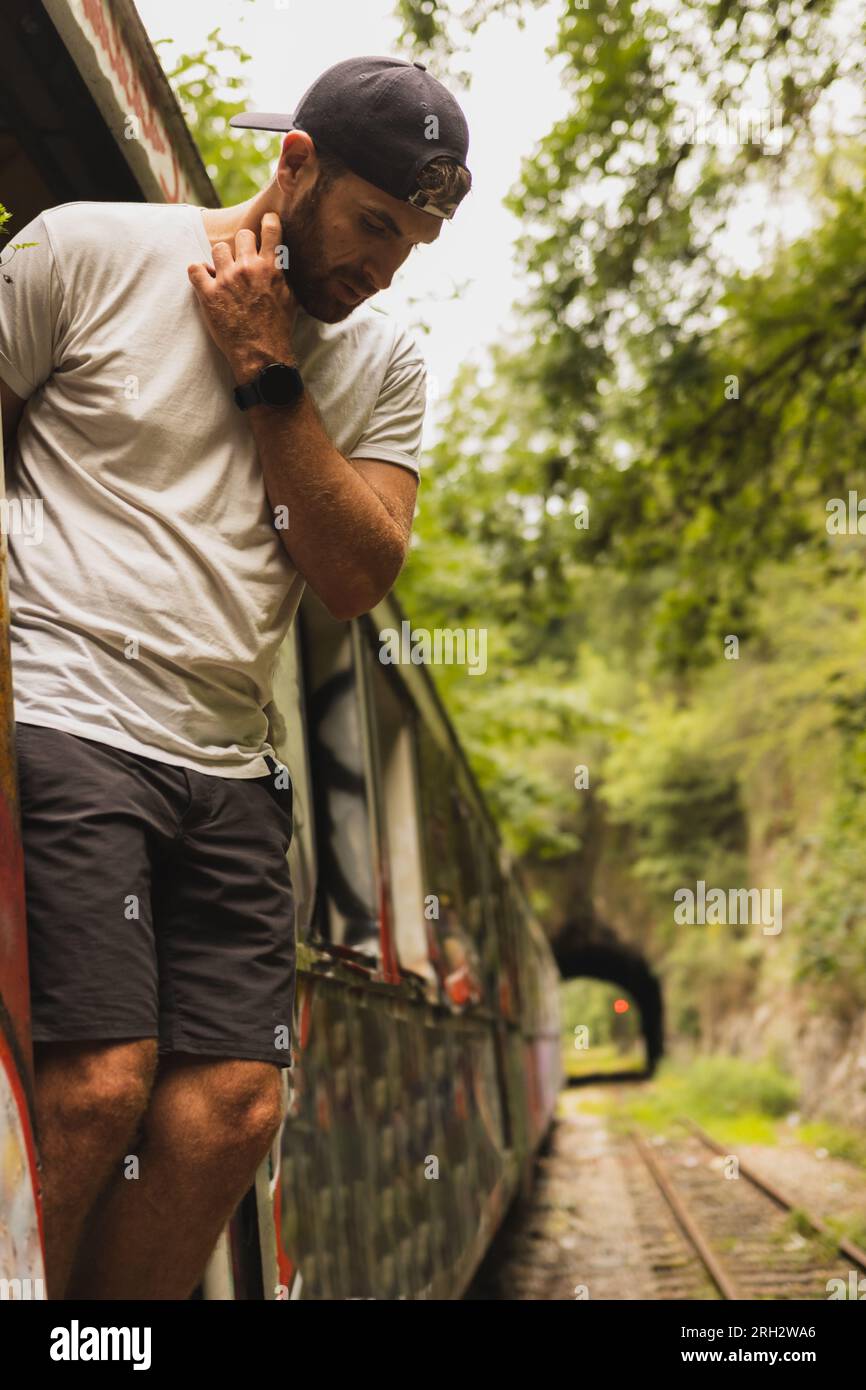 Man getting off a train Stock Photo - Alamy