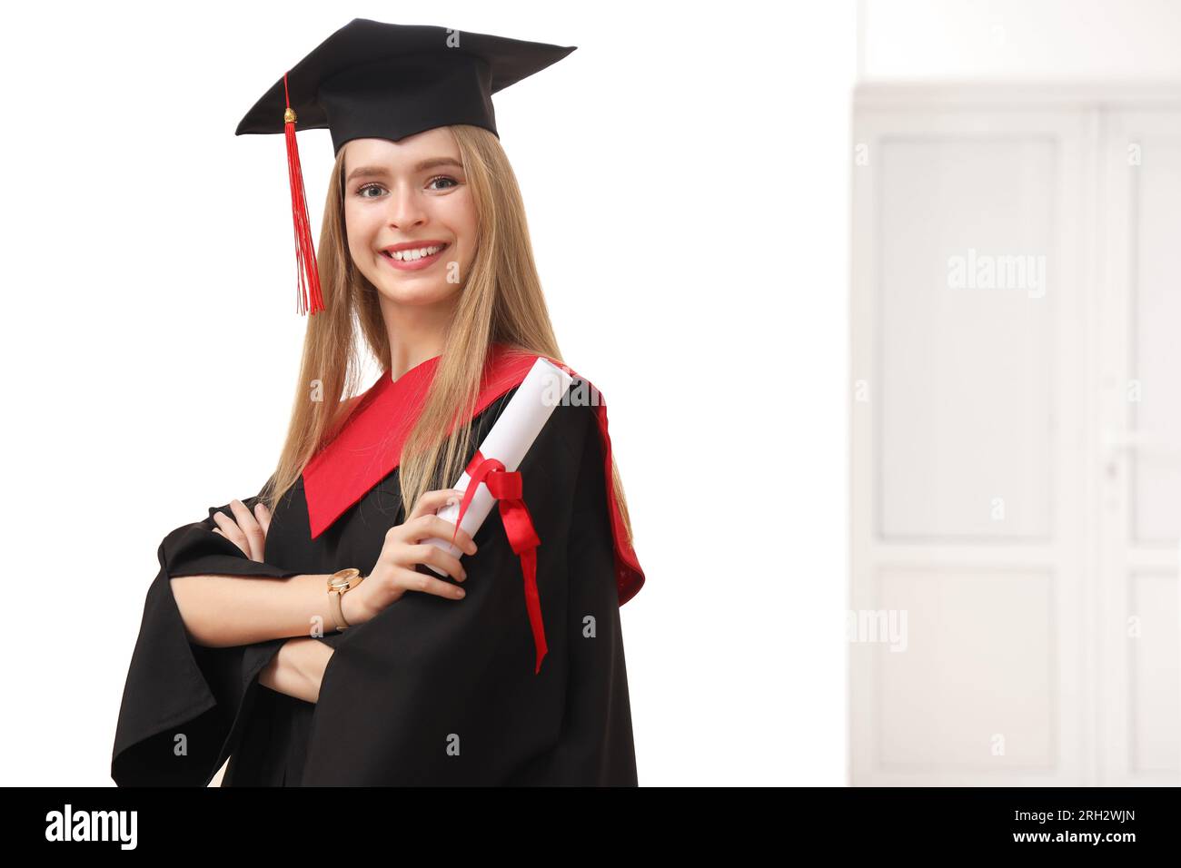 Female graduate student with diploma in hall Stock Photo - Alamy