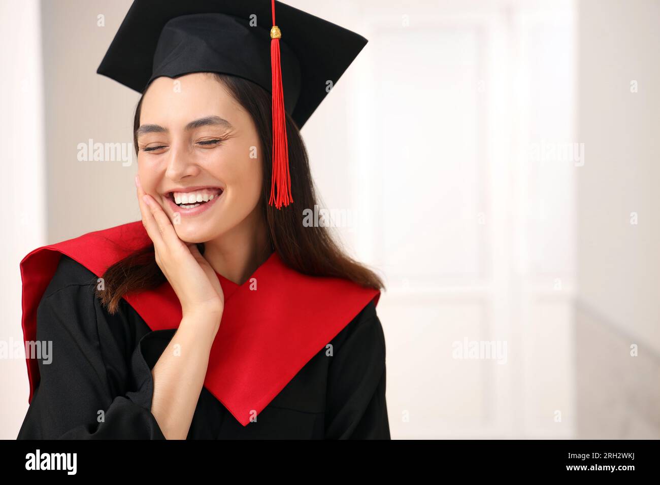 Happy female graduate student in hall, closeup Stock Photo - Alamy