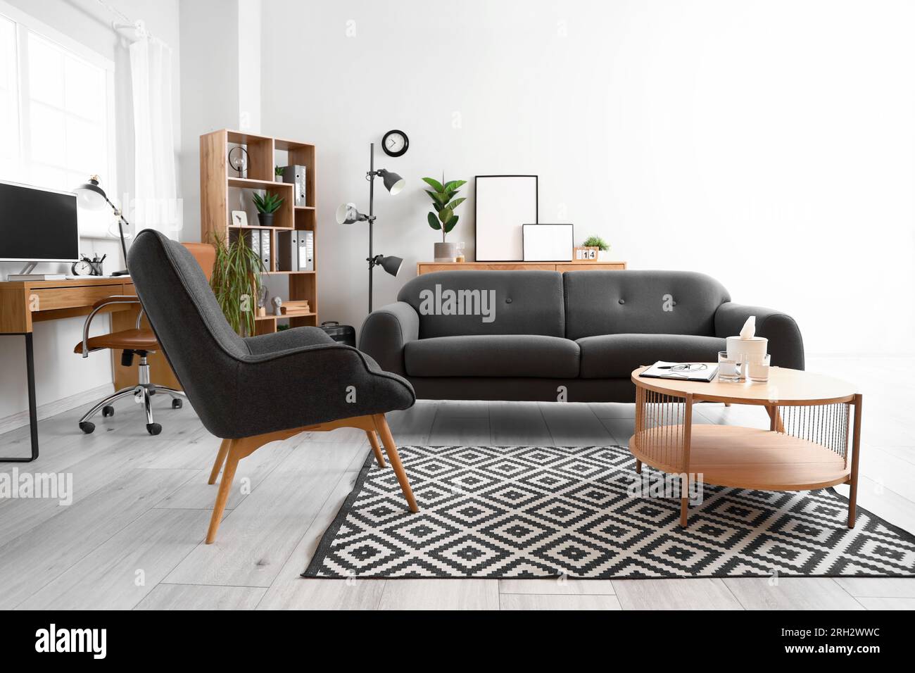 Interior of psychologist's office with sofa and table Stock Photo - Alamy