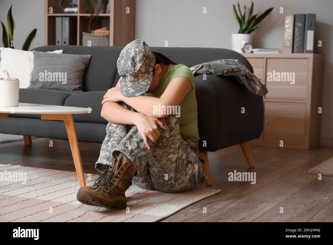 Stressed female soldier at psychologist's in office Stock Photo - Alamy