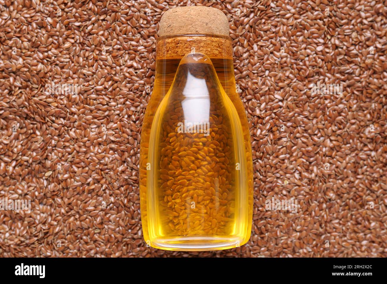 Bottle of flax oil on seeds, closeup Stock Photo - Alamy