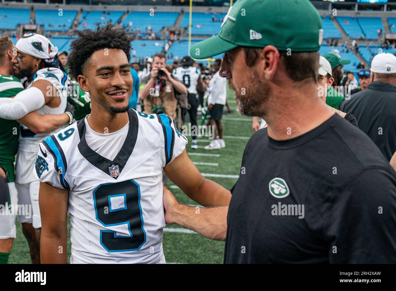 Carolina Panthers quarterback Bryce Young (9) talks with New York Jets ...