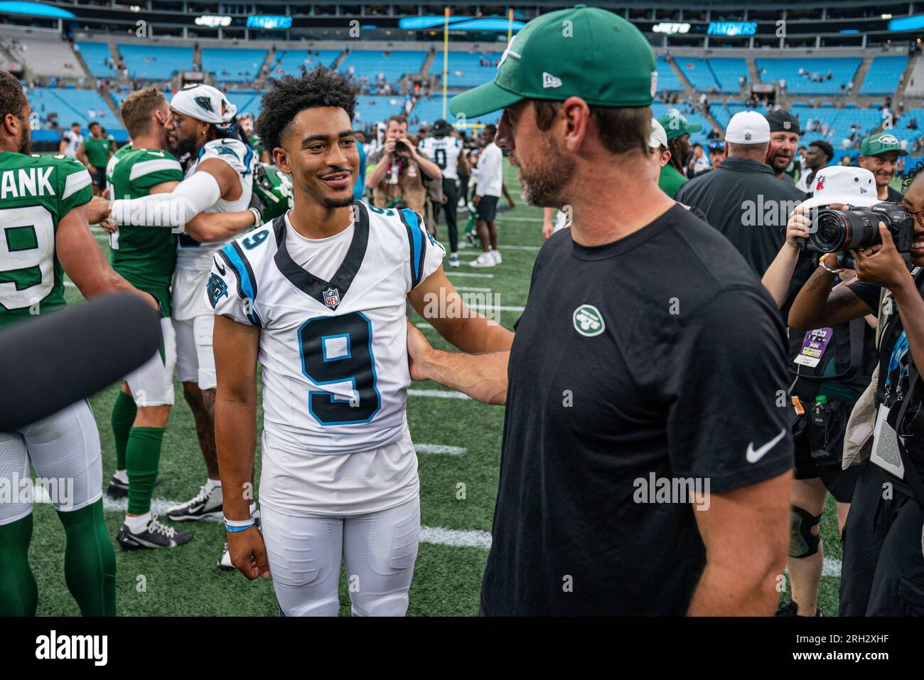 Carolina Panthers quarterback Bryce Young (9) talks with New York Jets ...