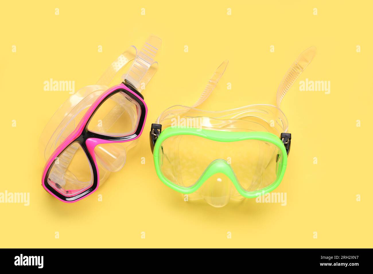 Different swimming masks on yellow background Stock Photo - Alamy