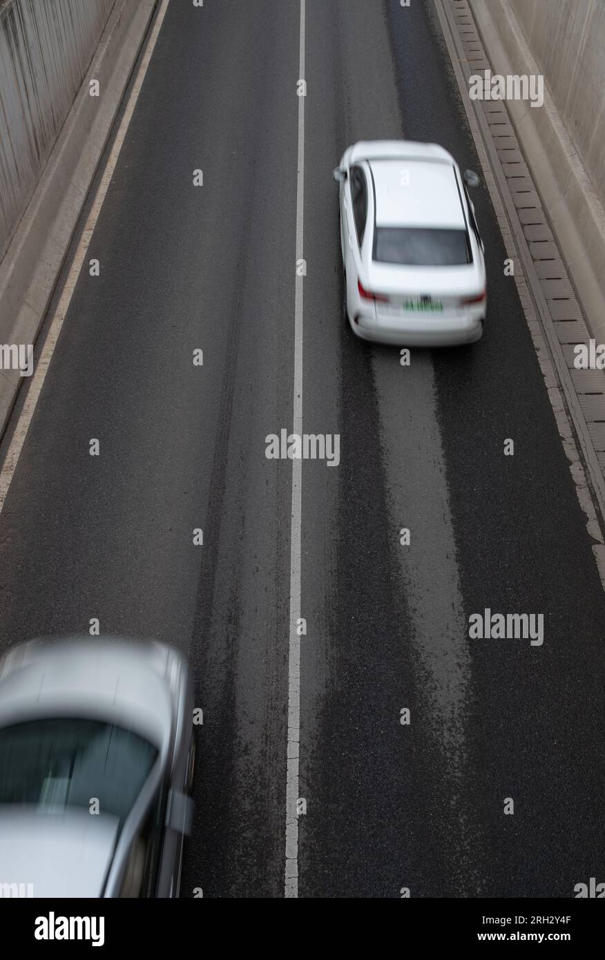 high angle view two cars driving on blacktop Stock Photo - Alamy