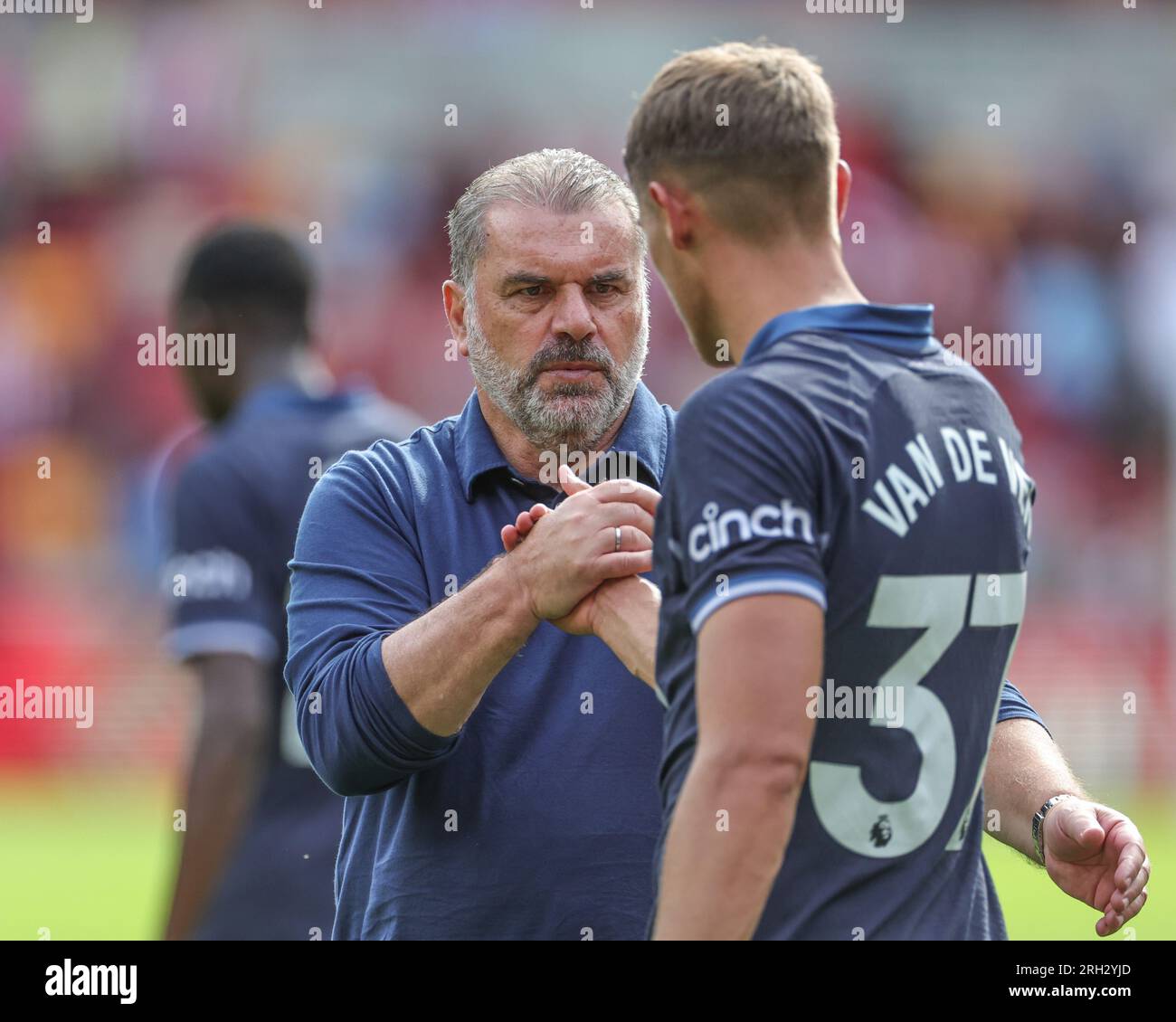 Ange Postecoglou head coach of Tottenham Hotspur shakes hands with ...