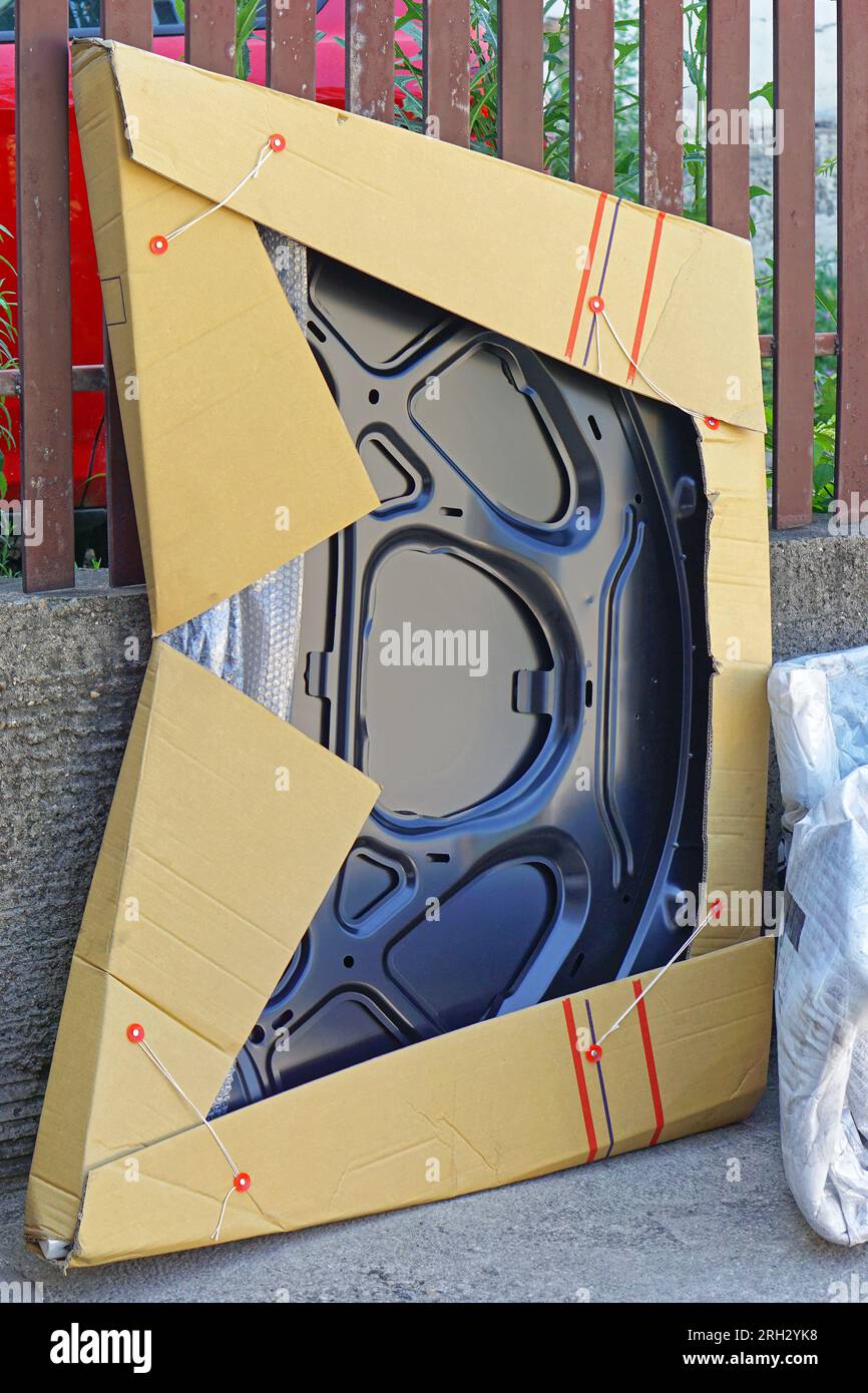 New hood car part delivery in cardboard box packad for transport Stock ...