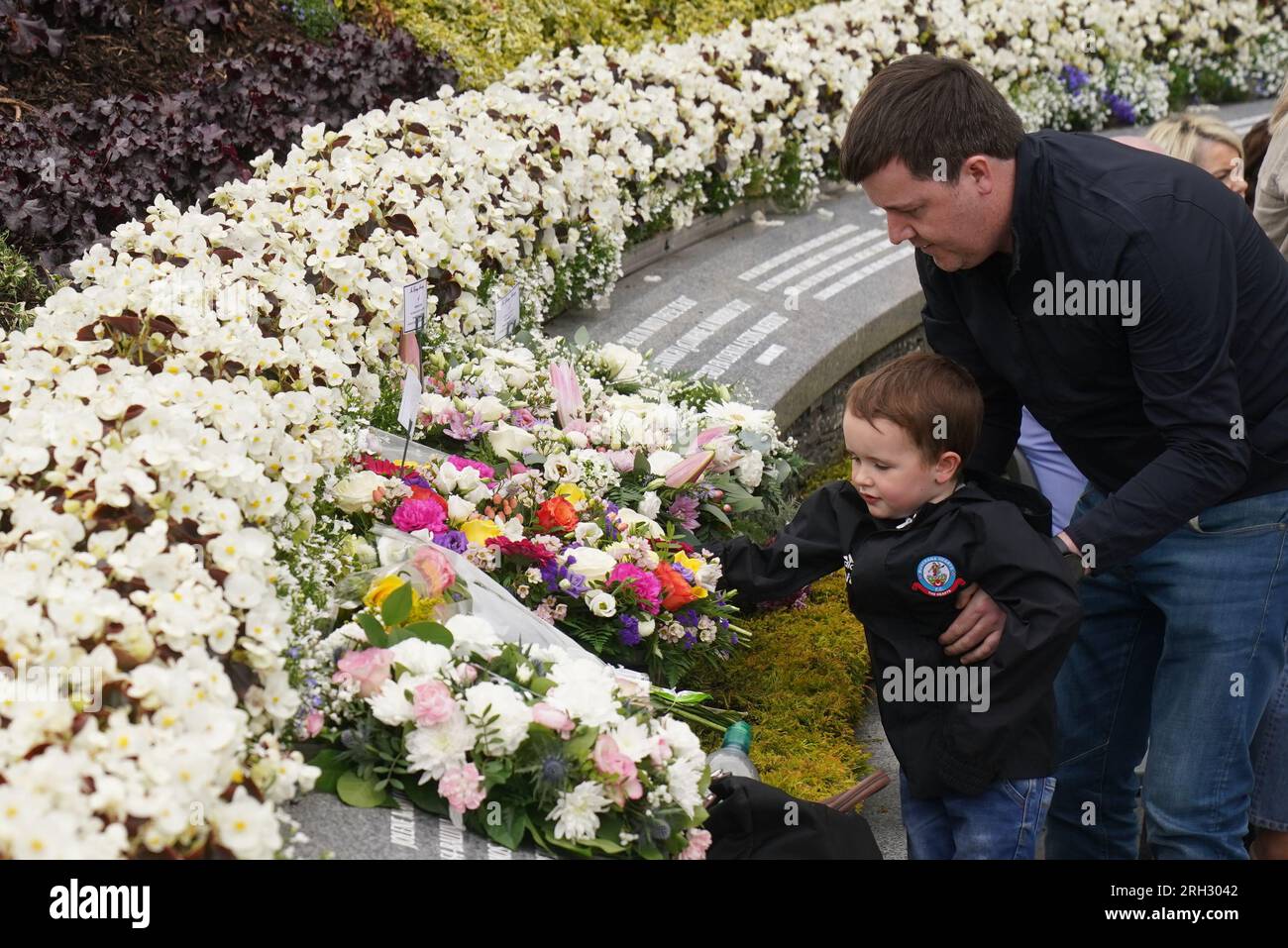 Gearoid Doherty (right) who lost his brother Oran in the bombing, lifts ...