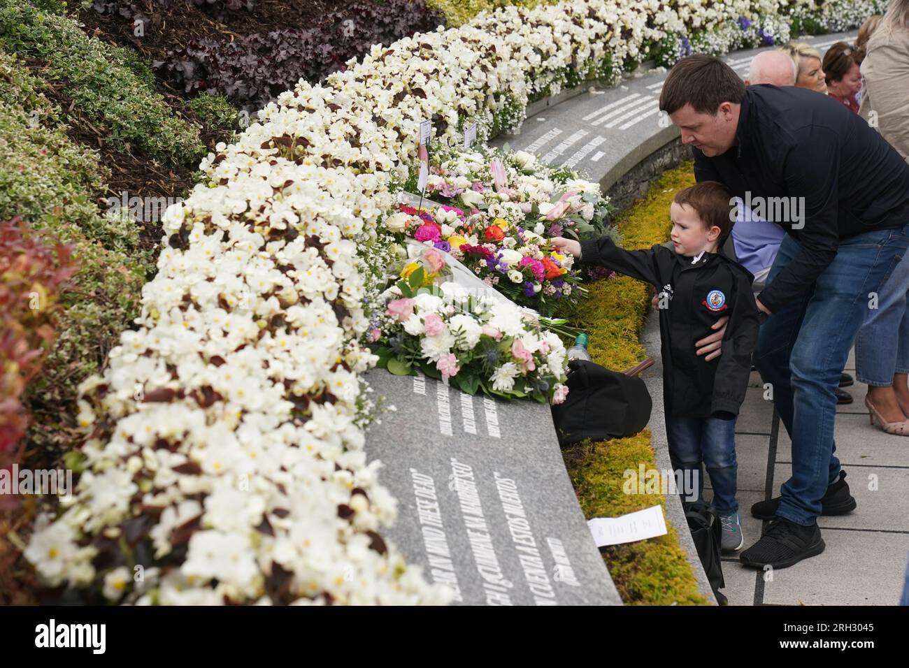 Gearoid Doherty (right) who lost his brother Oran in the bombing, lifts ...
