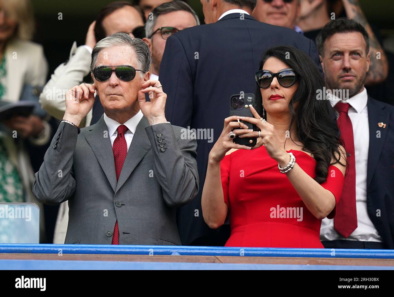 Liverpool owner John W Henry (left) and wife Linda Pizzuti Henry in the ...
