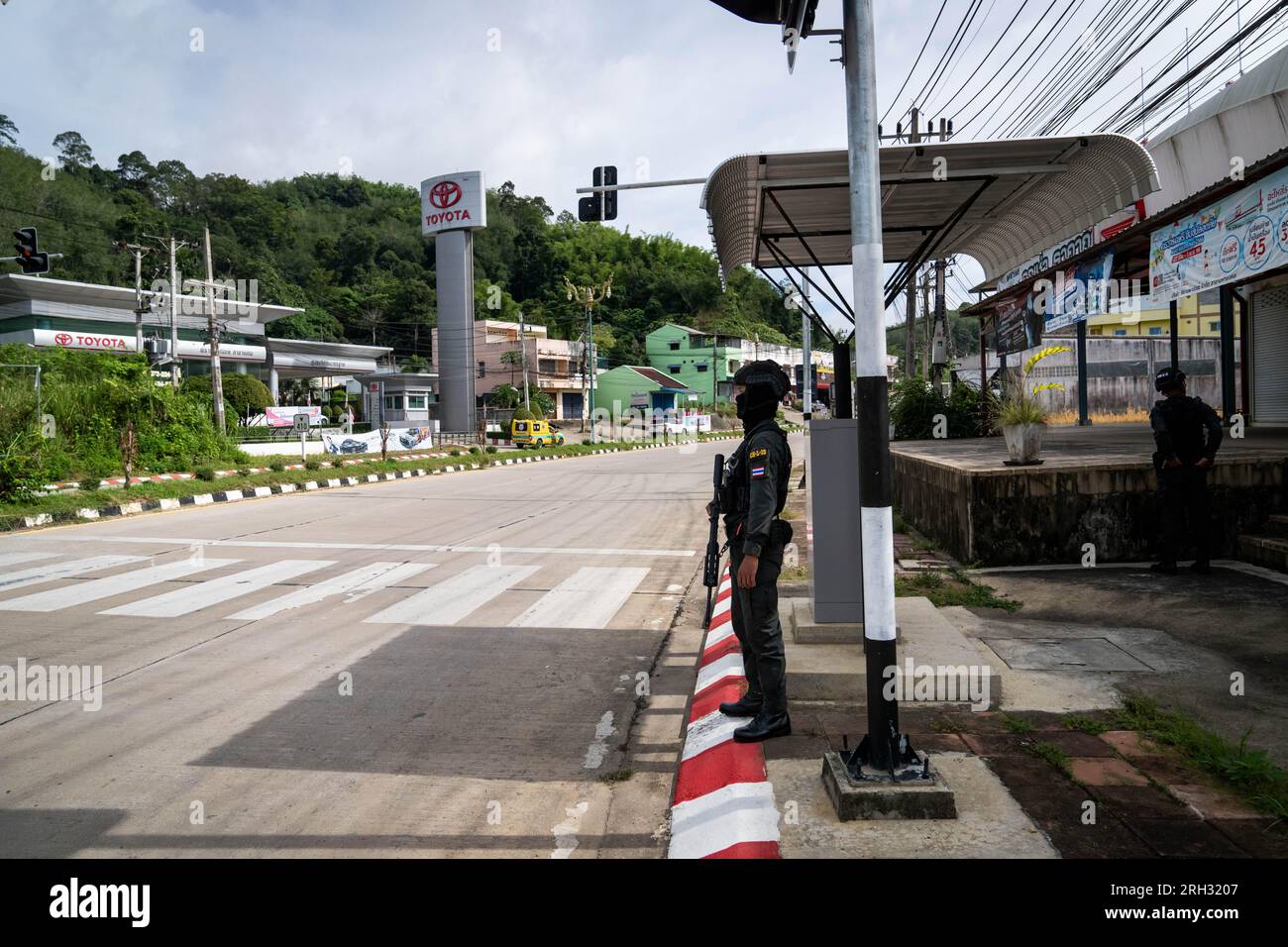 An armed border patrol officer stands on the street in Betong. Daily ...