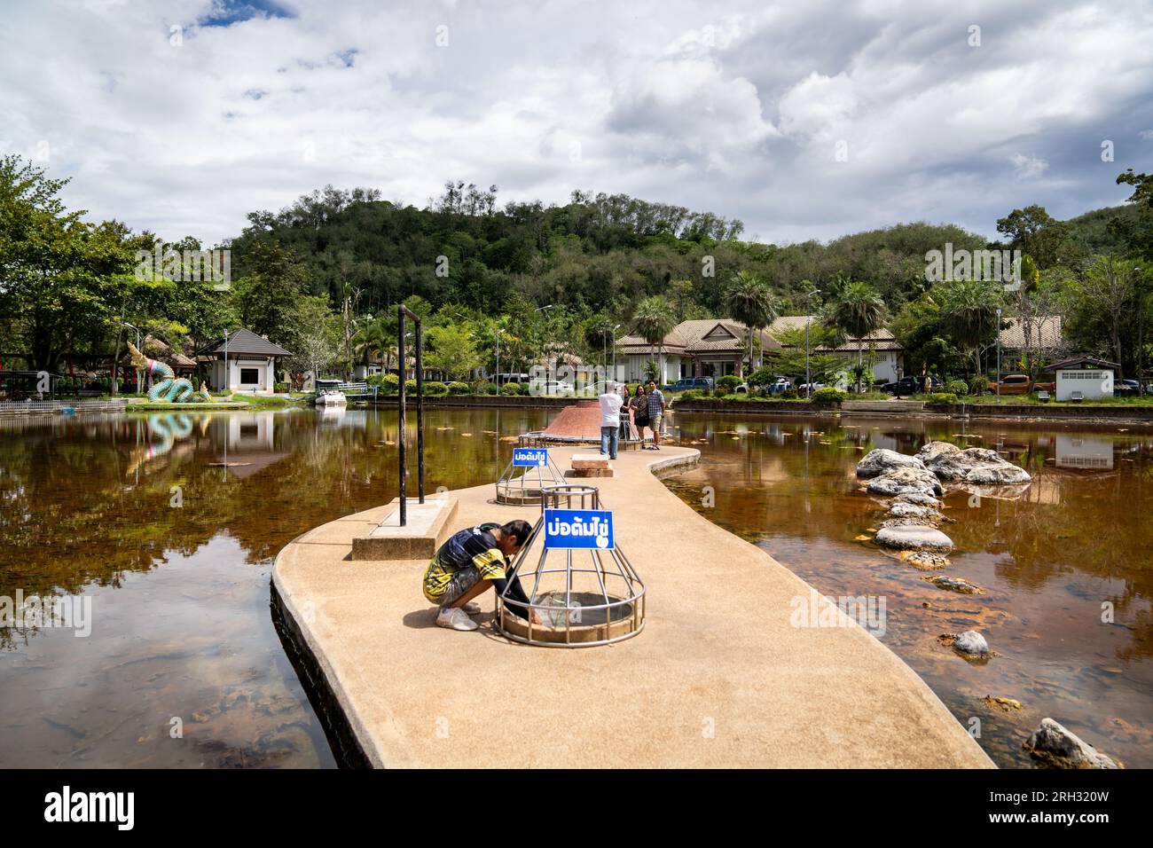 A man boils eggs at Betong Hot Springs. Daily life in Betong, Yala ...