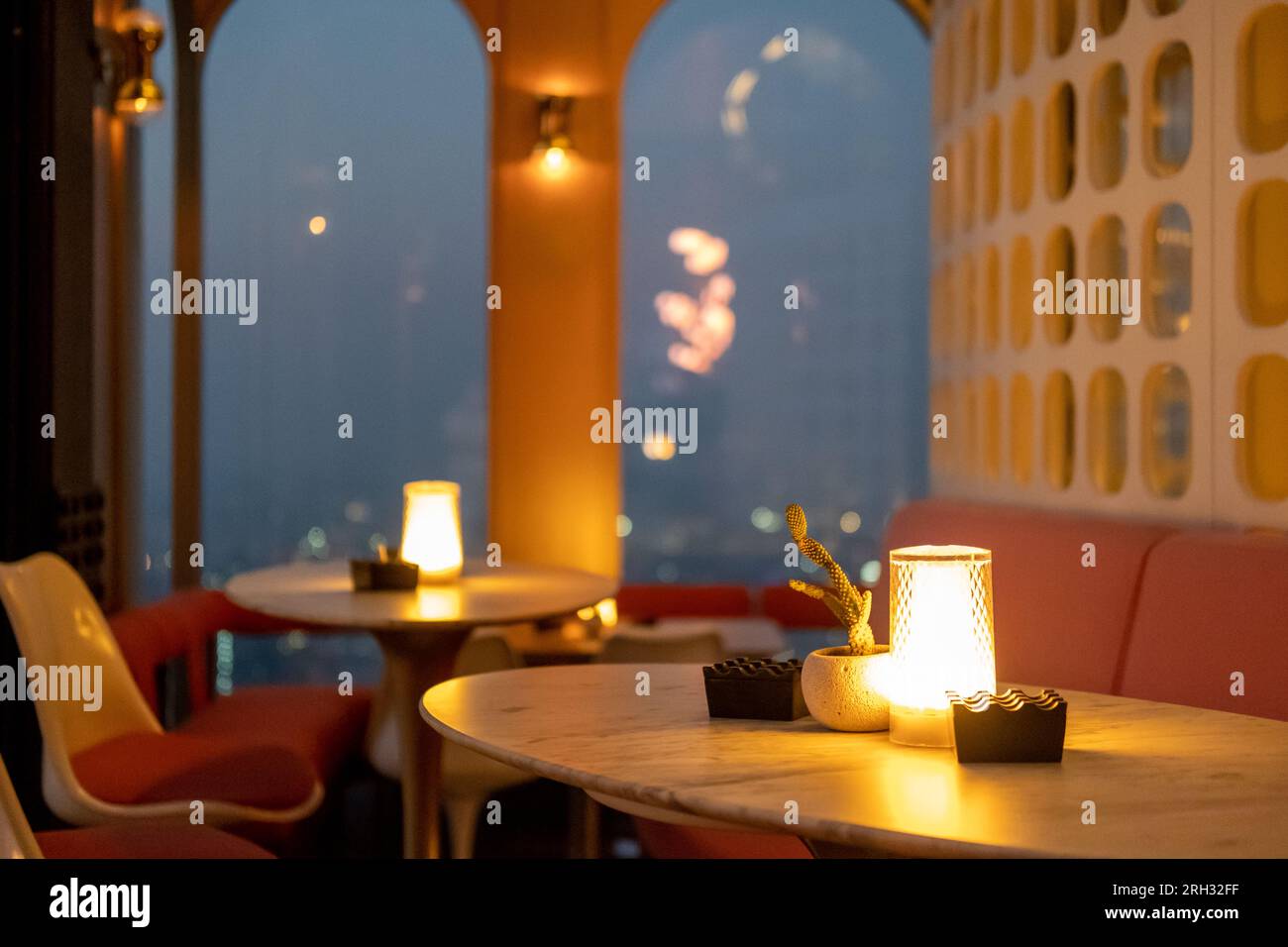 Seating on the terrace of the restaurant with a sky view during sunset ...