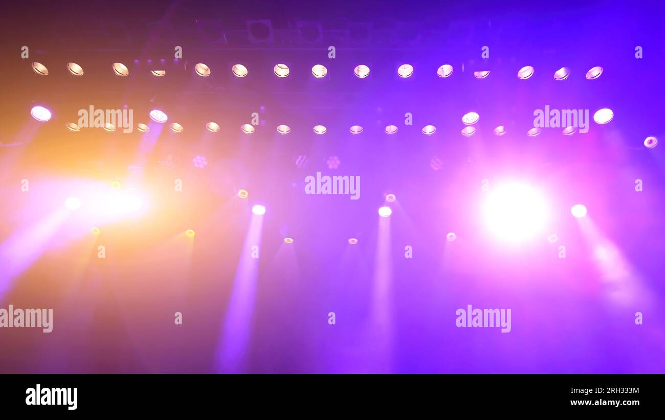 glowing purple atmospheric abstract background of concert spotlights ...