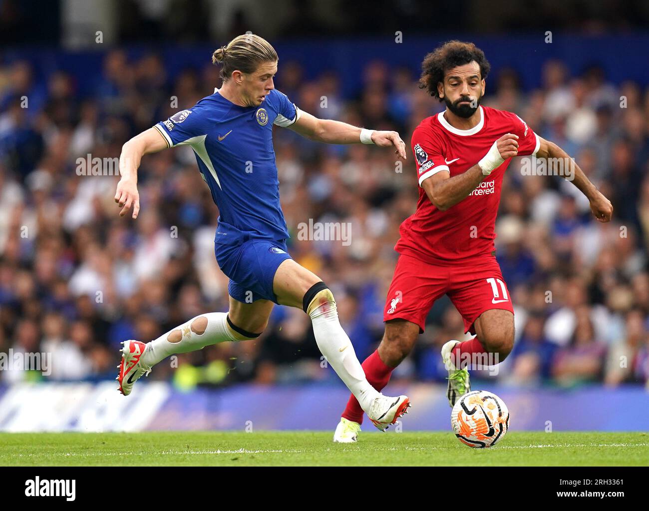 Liverpool's Mohamed Salah (right) and Chelsea's Conor Gallagher battle ...