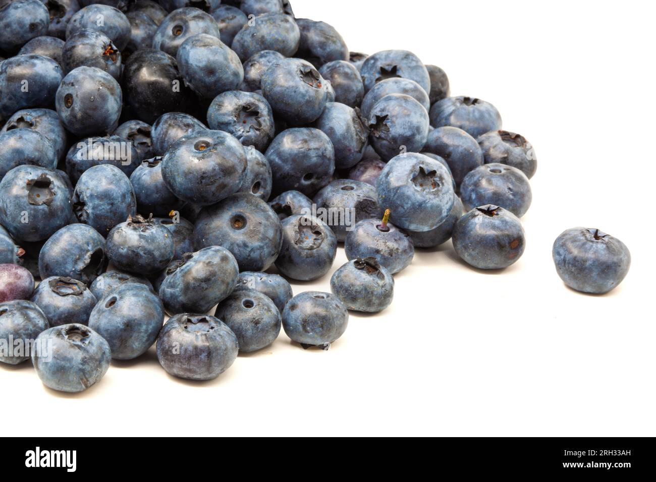 A bunch of blueberries are scattered on the table. Horizontal. Photo in ...