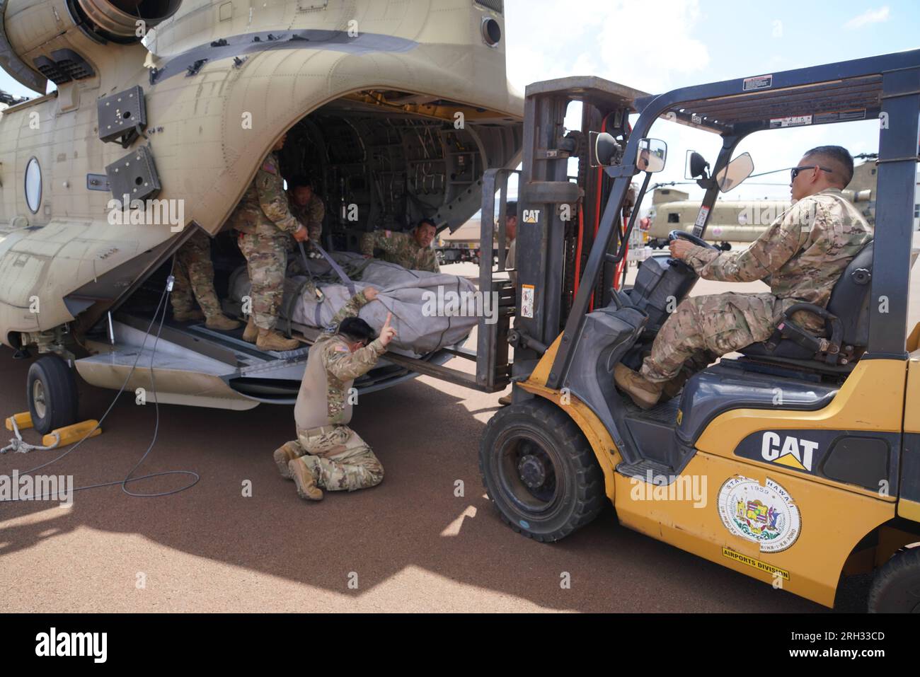 Two Hawaii Army National Guard CH47 Chinook perform aerial water bucket ...