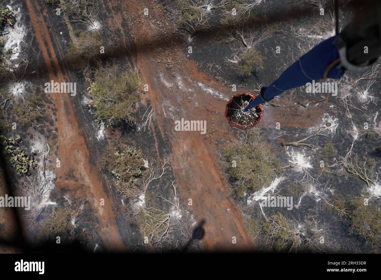 Two Hawaii Army National Guard CH47 Chinook perform aerial water bucket ...