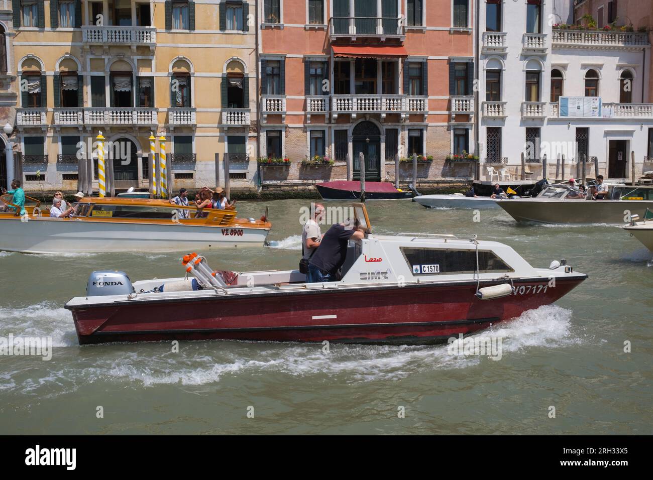Tourists travelling water taxi along hi-res stock photography and ...