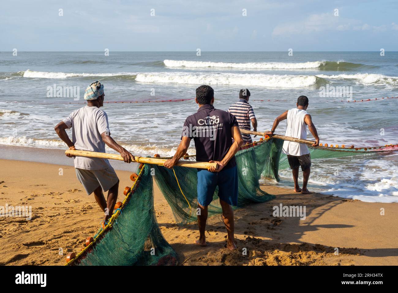GOA INDIA - SEPT 25: Indian fishermen workers catching fish and pull ...