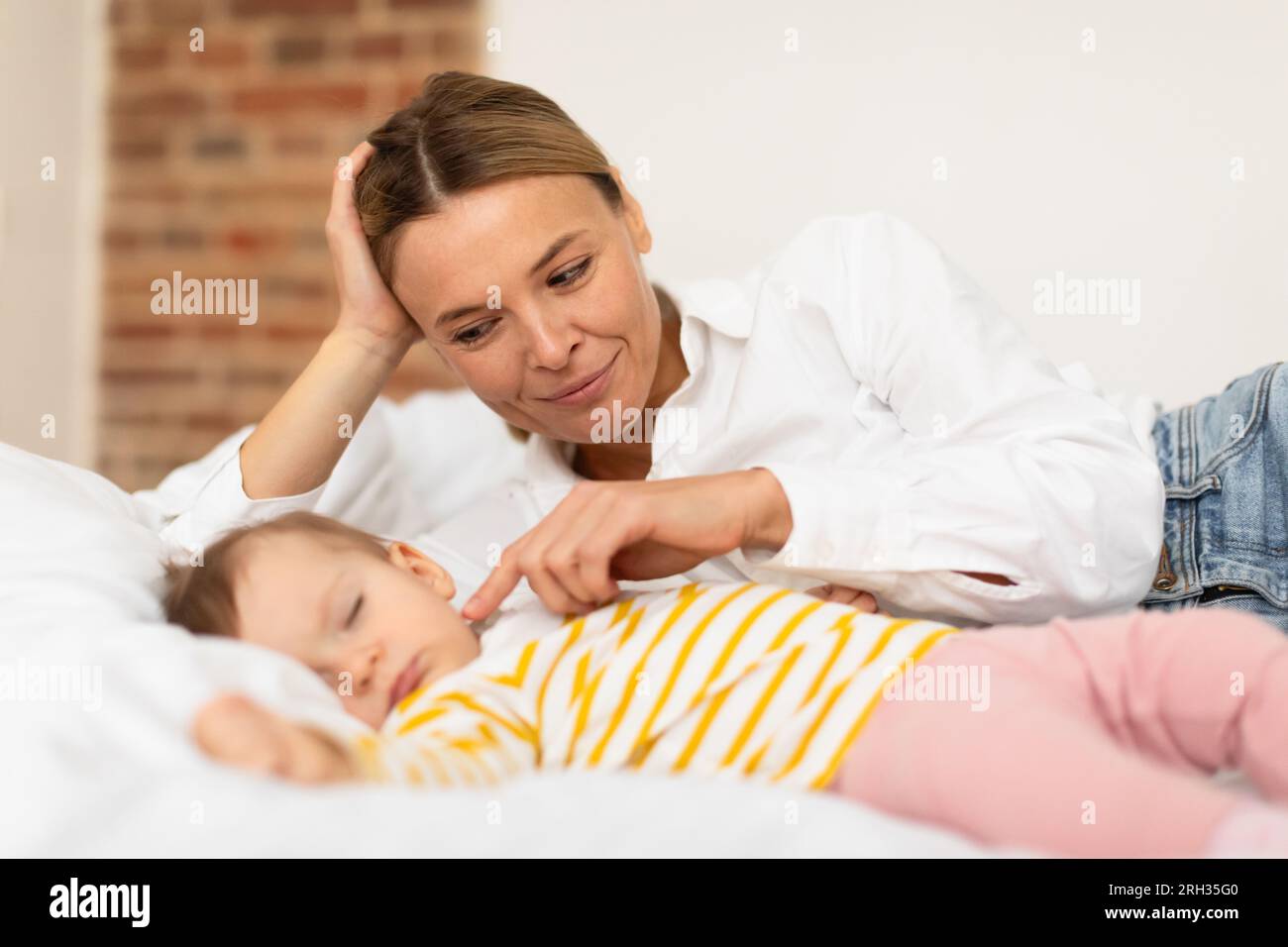 Touching cheek in bed hi-res stock photography and images - Alamy