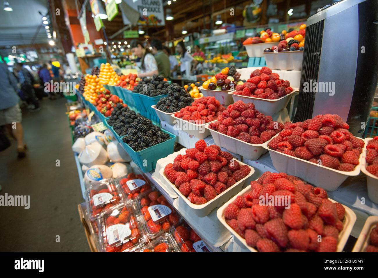 Punnets of berries for sale at the market on Granville Island in ...
