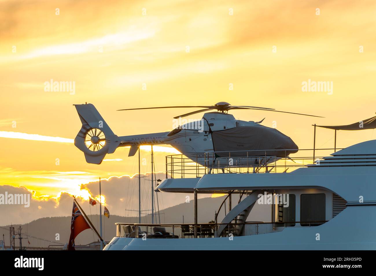 A private helicopter on the deck of a private yacht moored in Vancouver ...