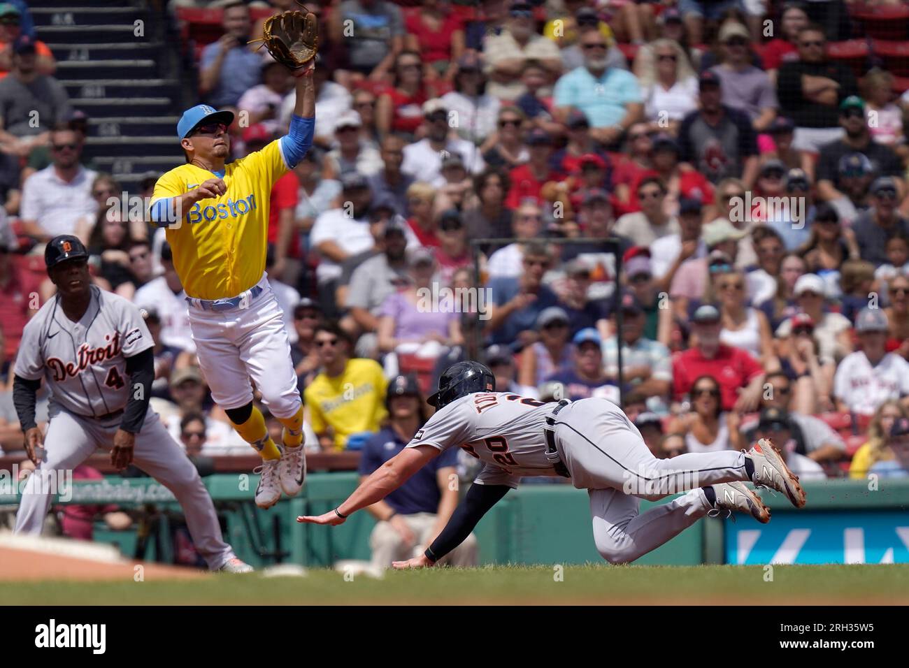 Detroit Tigers' Spencer Torkelson, right, slides safe at third as ...
