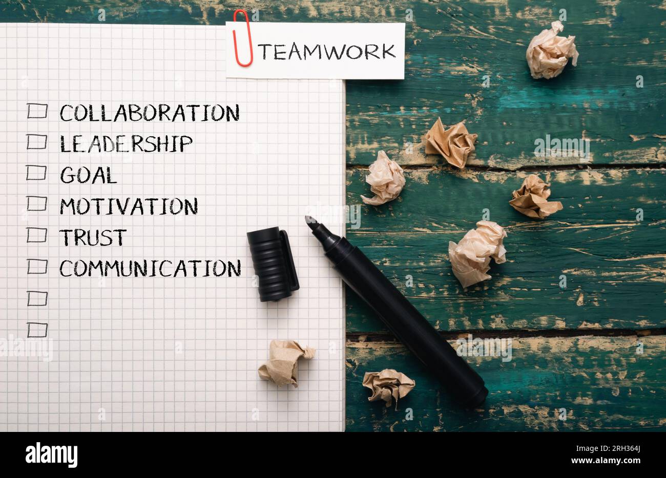 Description of what is Teamwork in a notebook in a cage Stock Photo - Alamy
