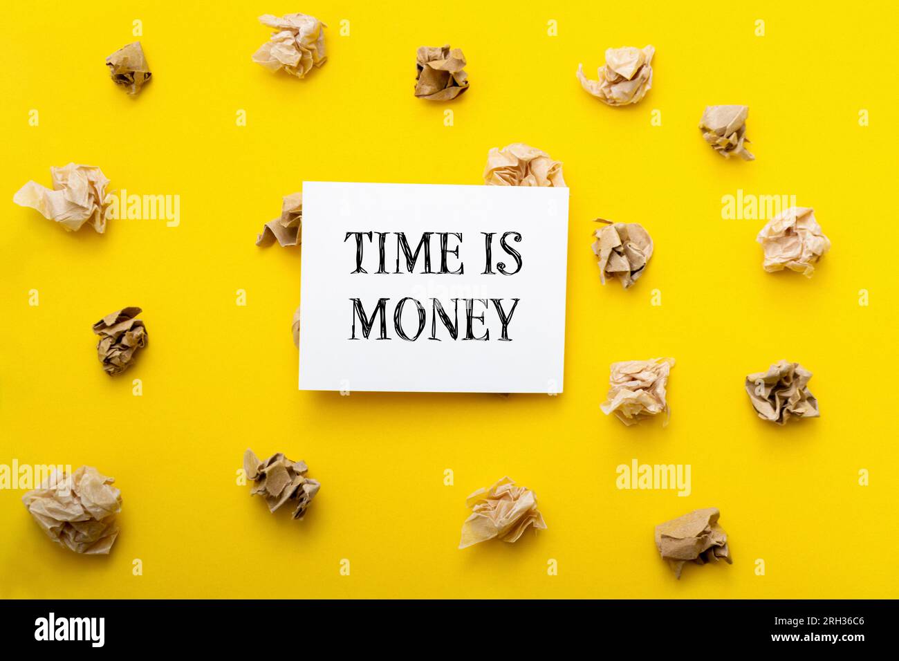 Text on a yellow background Time is money Stock Photo - Alamy
