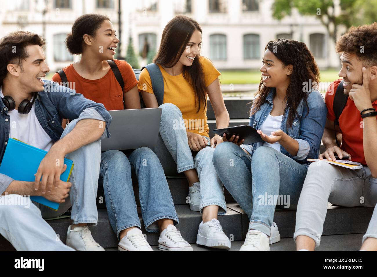 International Group Of Students Having Fun Together Outdoors, Relaxing ...