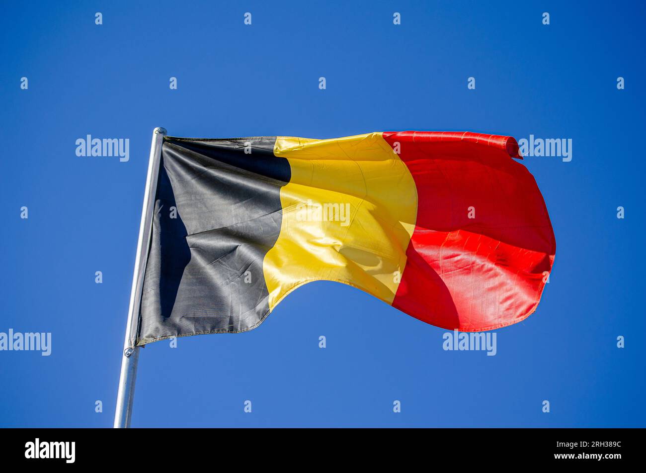 Blue sky background with belgium flag hi-res stock photography and ...