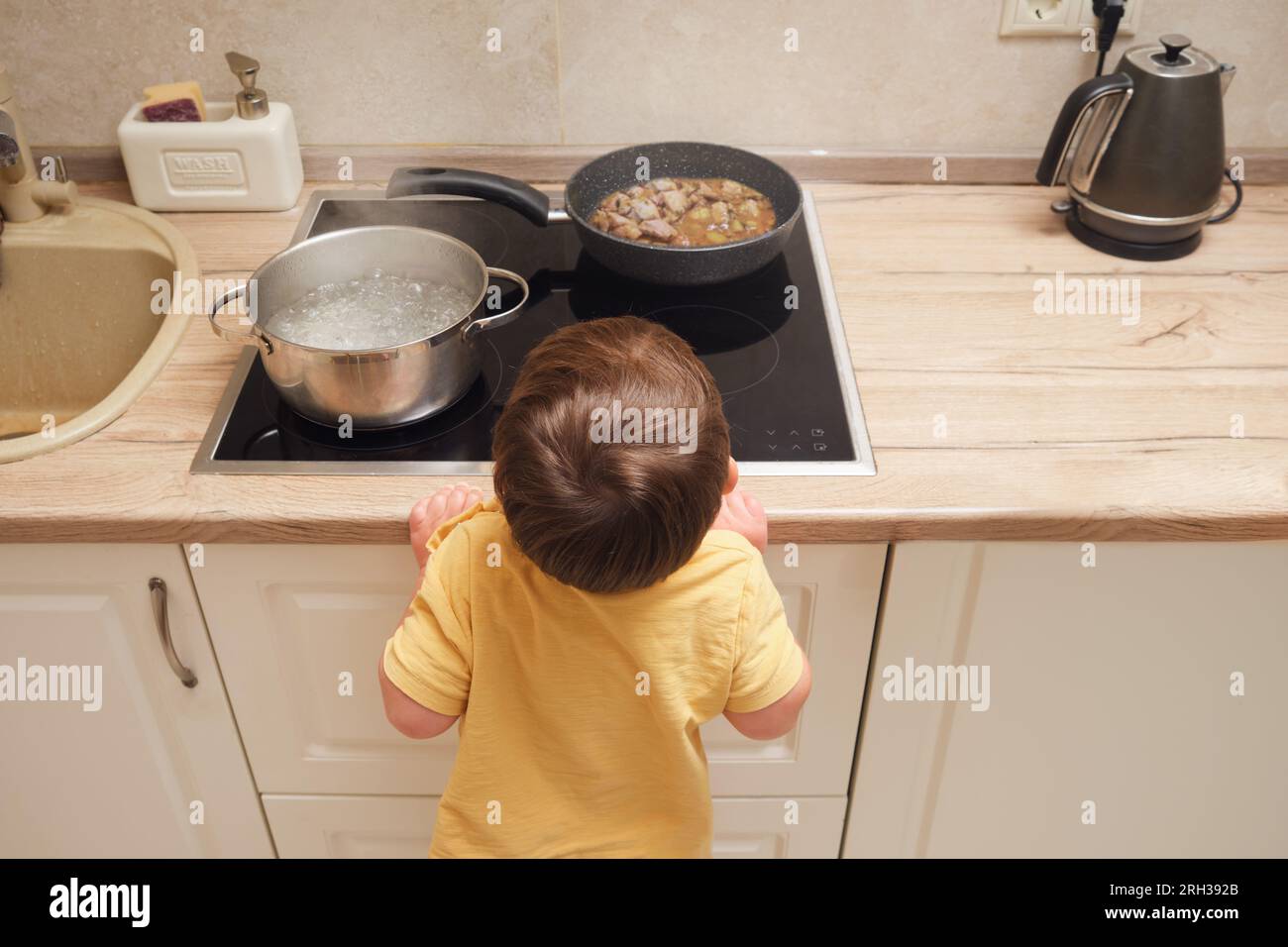 Baby reaching for a pot hi-res stock photography and images - Alamy