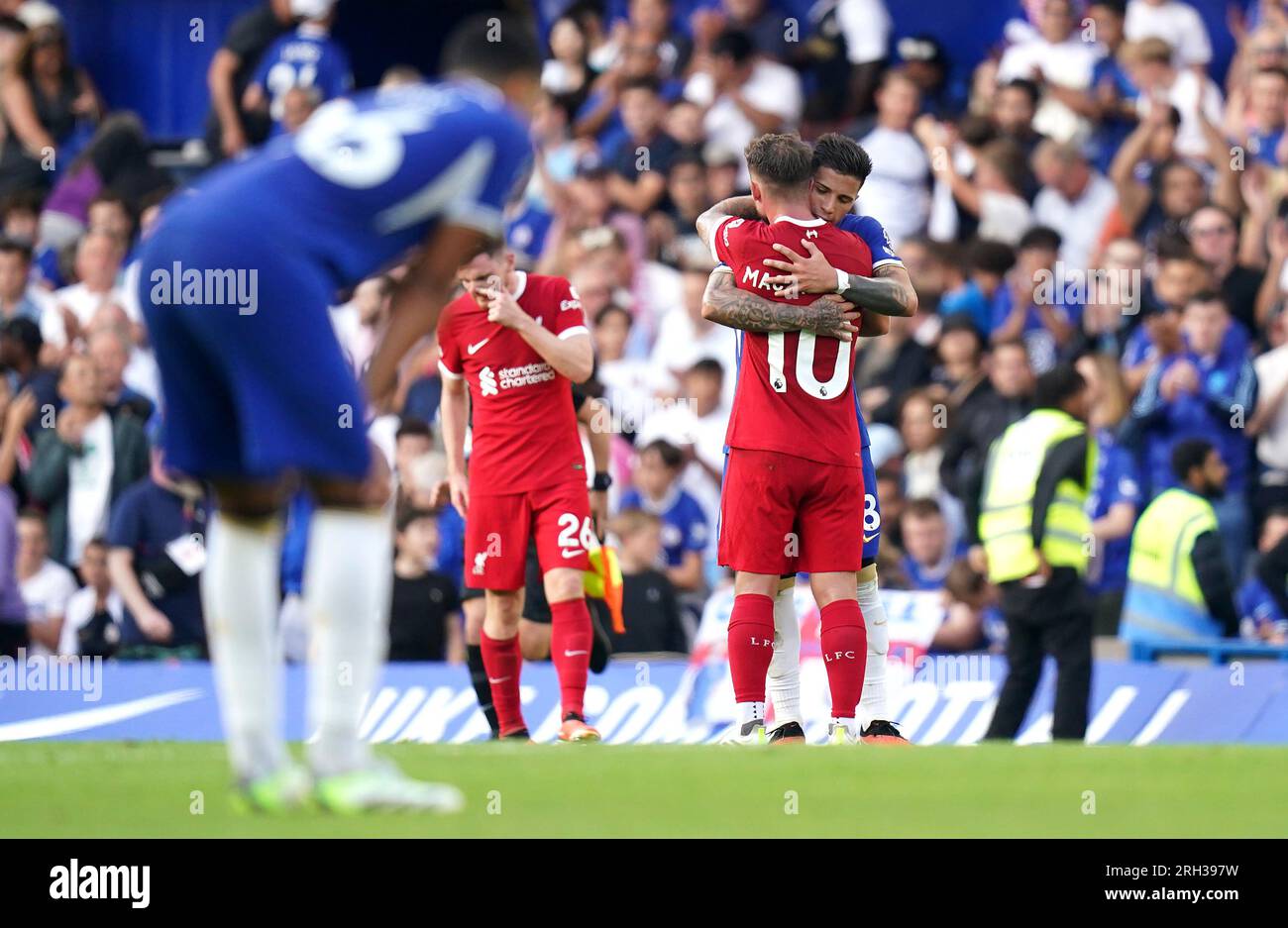 Liverpool's Alexis Mac Allister and Chelsea's Enzo Fernandez embrace ...