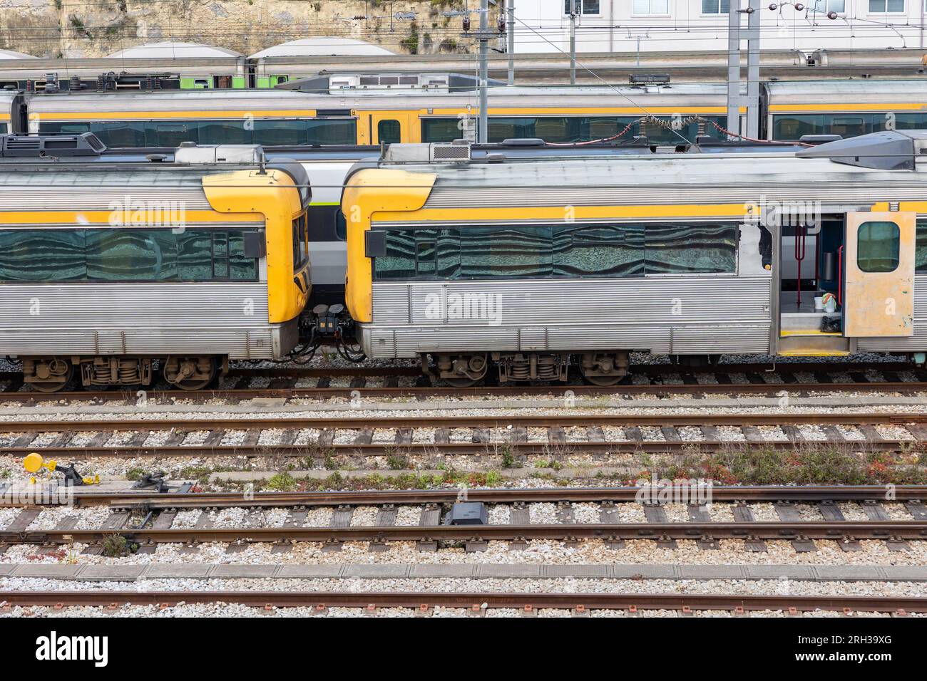 Old trains stand on the rails at the railway depot. Mid shot Stock ...
